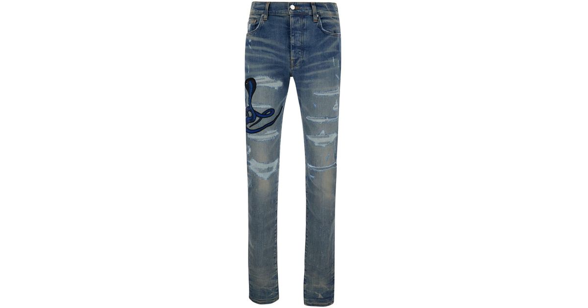 Amiri Light Skinny Jeans With Rips And Snake Patch in Blue for Men | Lyst