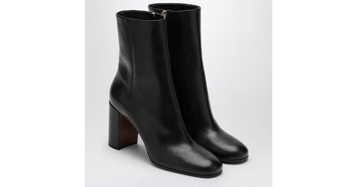 Prada Luxe Round Toe Leather Boot in Black | Lyst