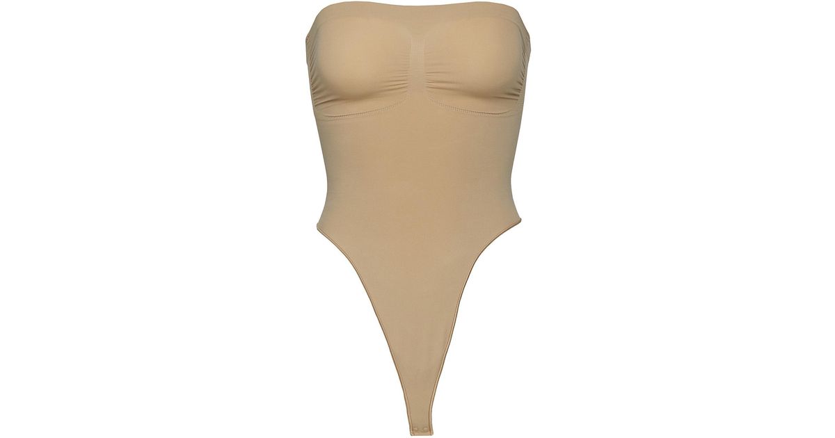 Skims Seamless Sculpt Strapless Thong Bodysuit In Natural Lyst