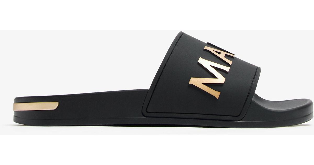 Mallet Serif Logo Slides in White | Lyst