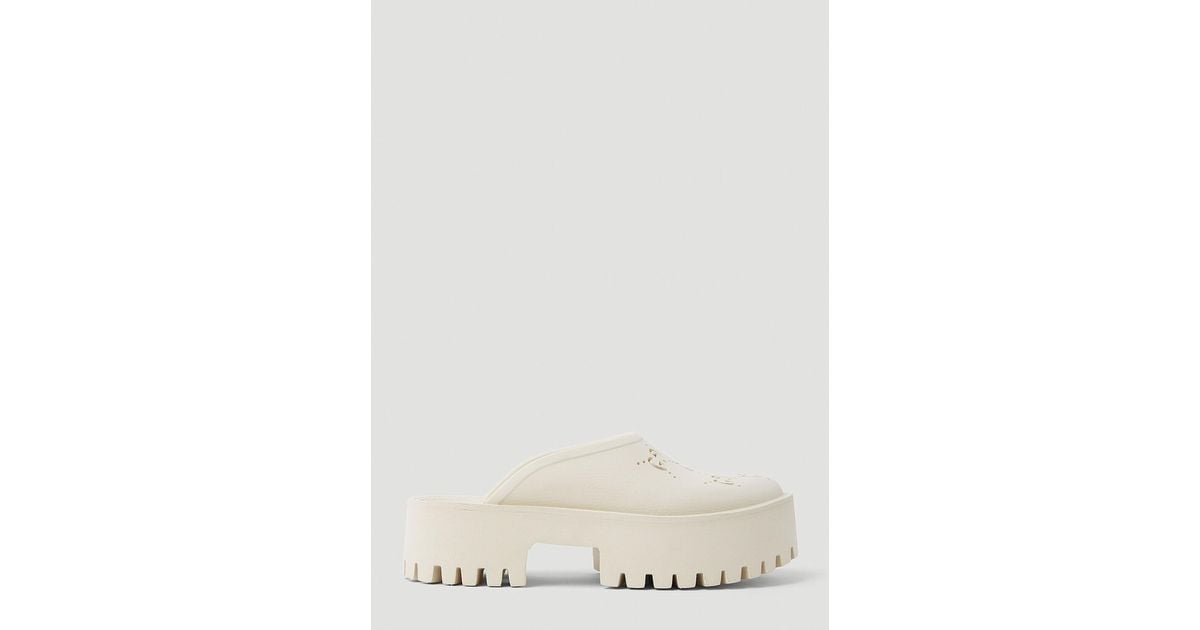 Gucci Perforated G Platform Mules in Natural | Lyst