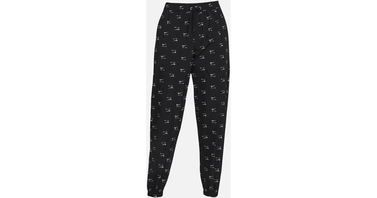 Nike All-Over Logo Track Pants in Black for Men | Lyst UK