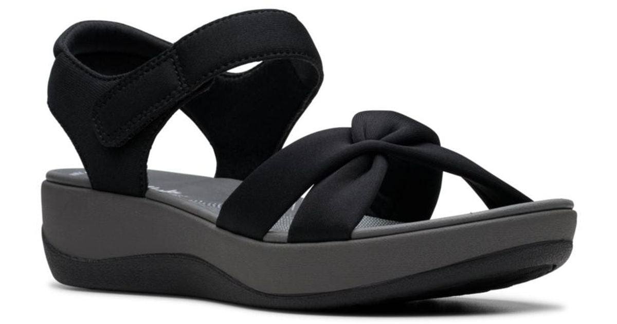 Clarks Arla Daisy Slip On Flat Sandals in Black | Lyst