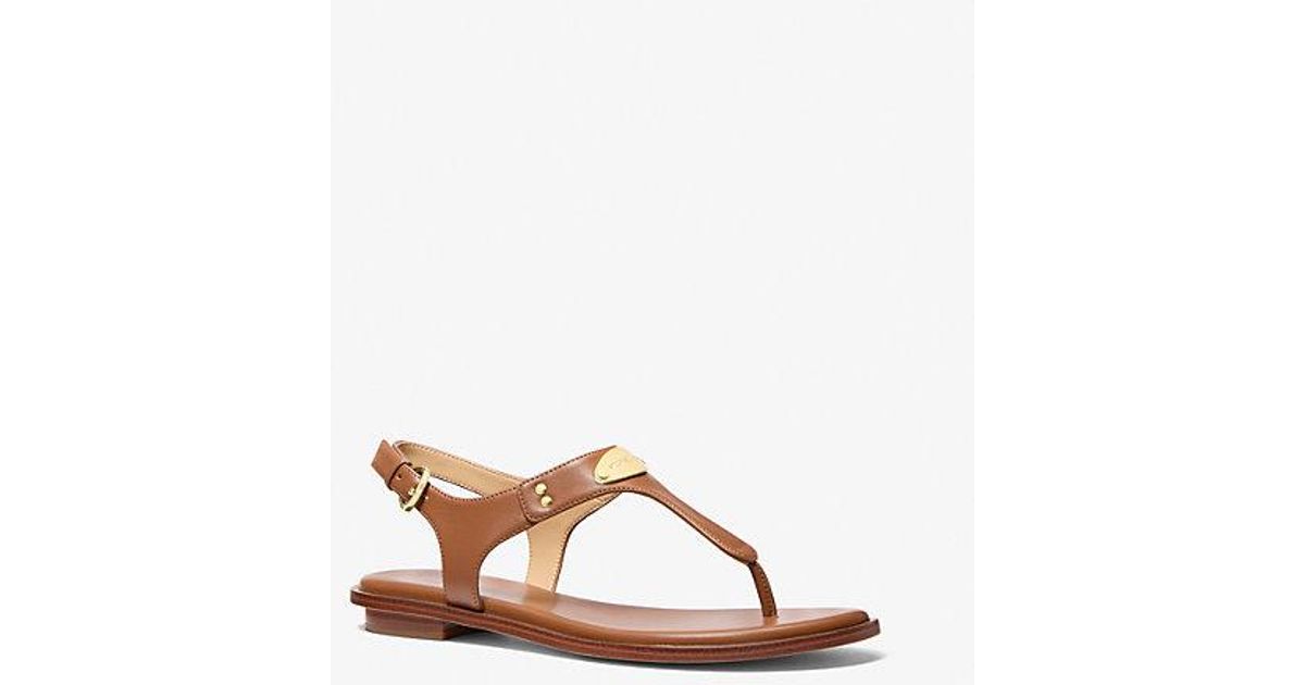 Michael Kors Logo Plate T-Strap Sandal in Natural | Lyst