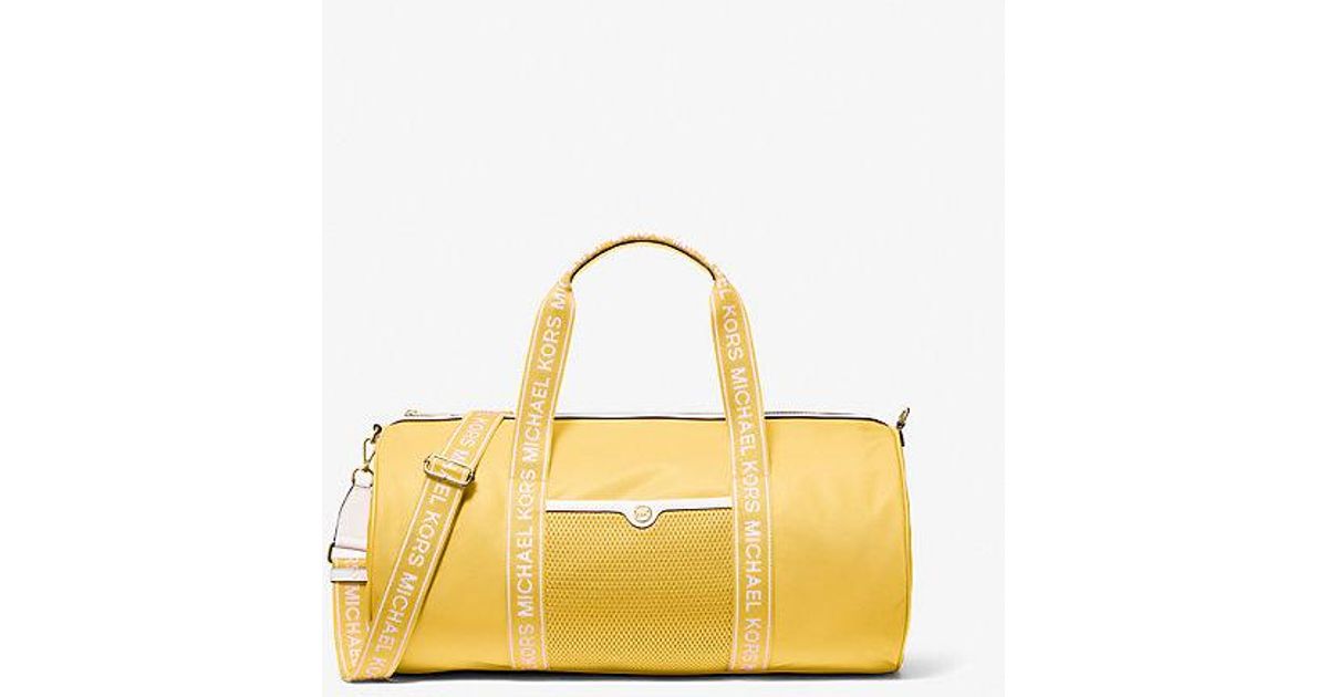 Michael Kors Jet Set Large Logo Tape Nylon Weekender Bag in Yellow | Lyst