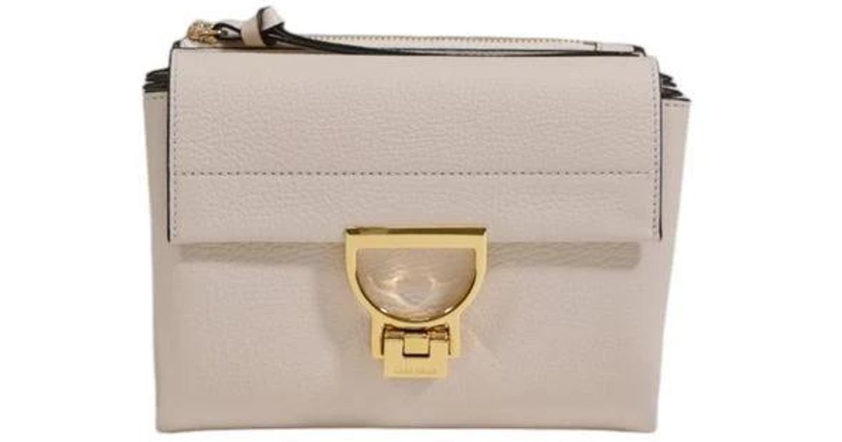 Coccinelle Handbags in White | Lyst