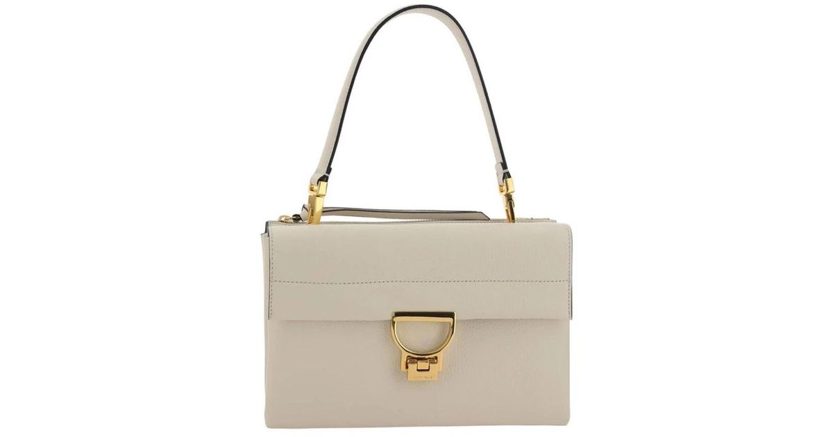 Coccinelle Handbags in Natural | Lyst