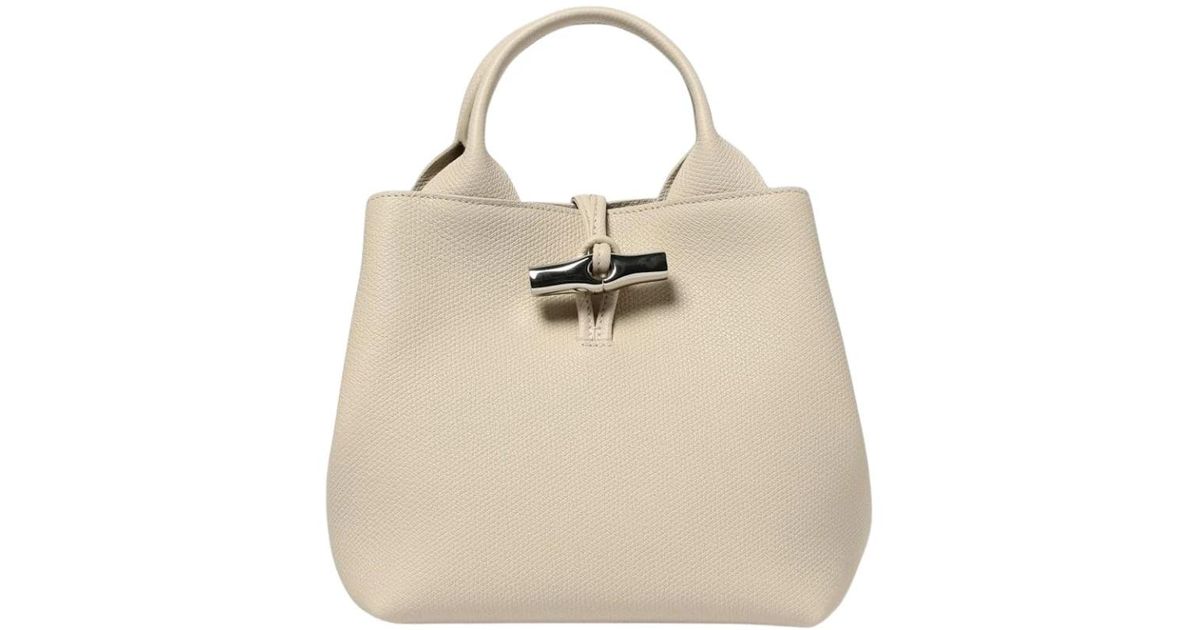 Longchamp Handbags in Natural | Lyst UK