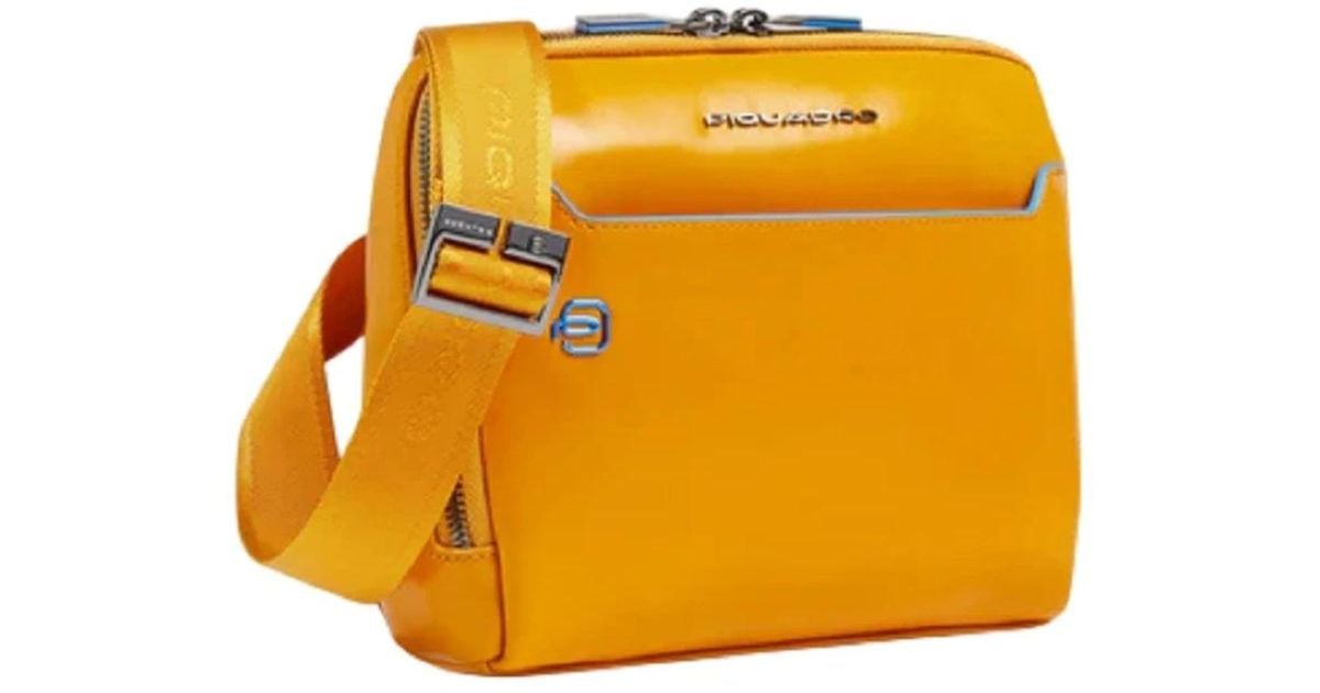 Piquadro Cross Body Bags in Yellow | Lyst UK
