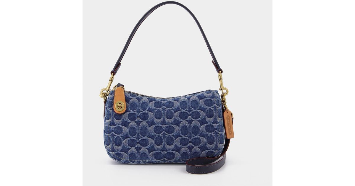 COACH Washed Denim Signature Swinger in Blue | Lyst COACH Washed Denim Signature Swinger in Blue | Lyst