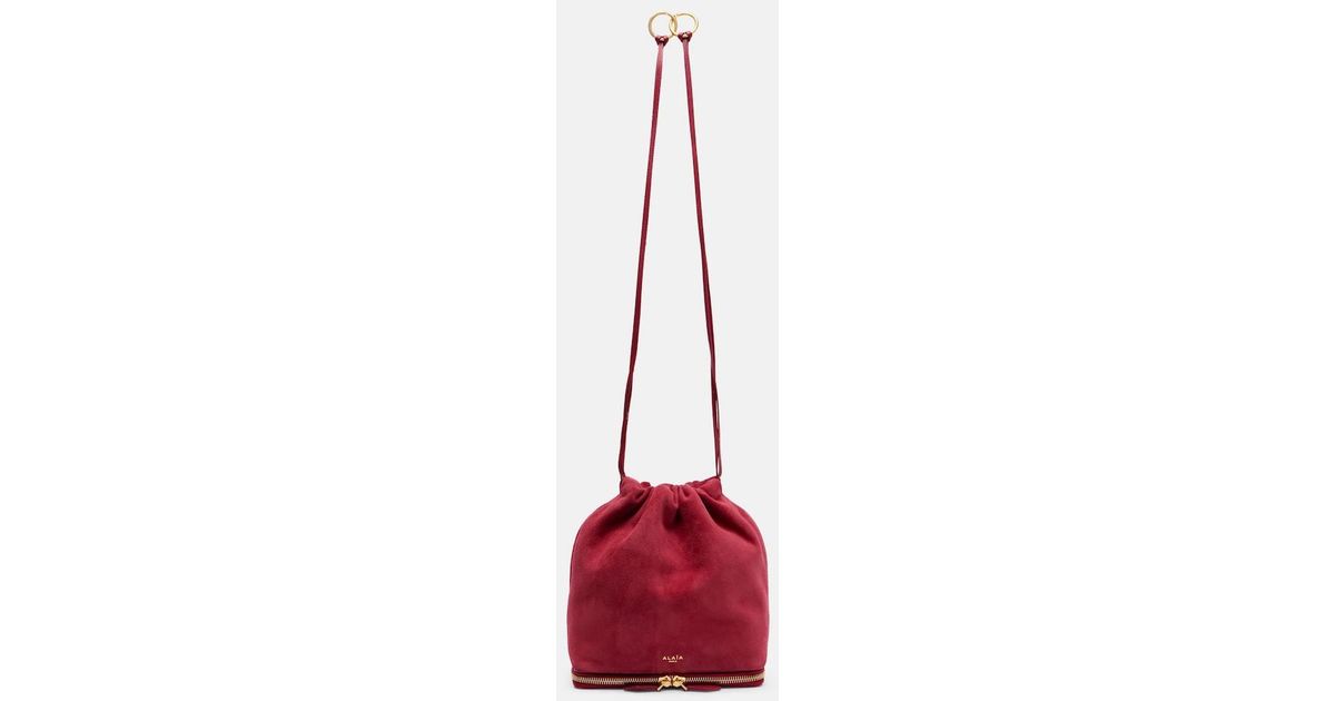 Alaïa Le Pochon Suede Bucket Bag in Red | Lyst