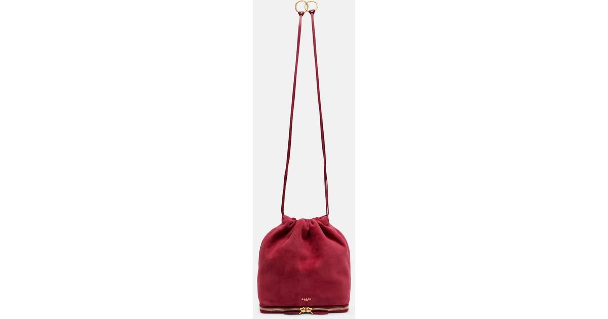Alaïa Le Pochon Suede Bucket Bag in Red | Lyst UK