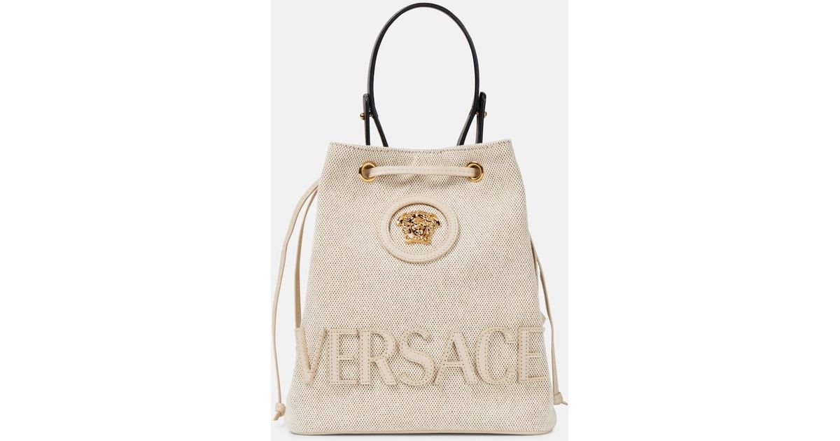 Versace La Medusa Small Canvas Bucket Bag in Natural | Lyst