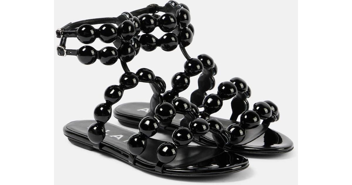 Alaïa Sphere Leather Sandals in Black | Lyst