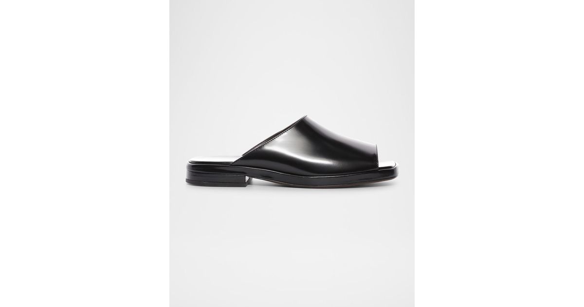 The Row Emi Leather Flat Mule Sandals in Black | Lyst