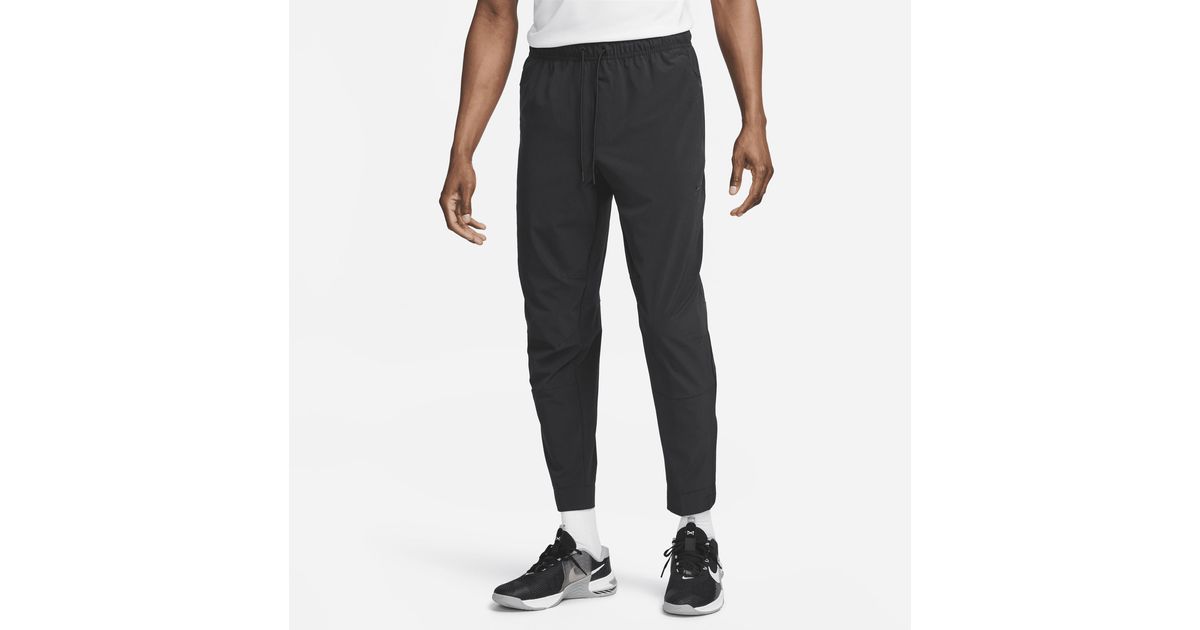 Nike Unlimited Dri-Fit Zippered Cuff Versatile Pants in Black for Men ...