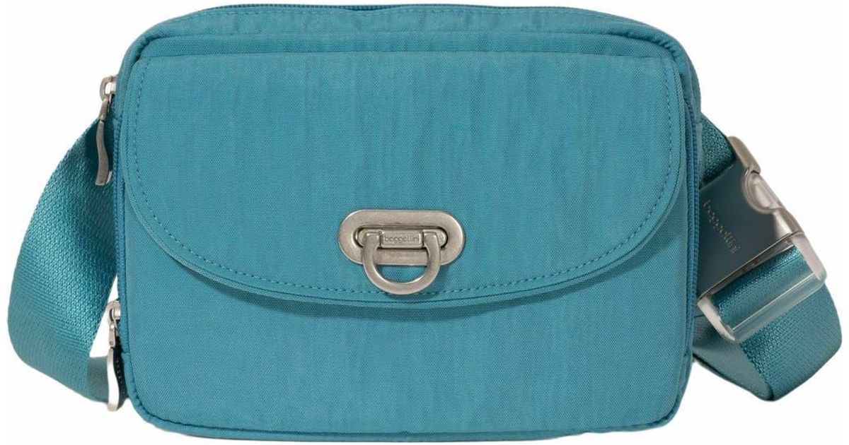 Baggallini Coastal Flip Lock Sling Bag in Blue | Lyst