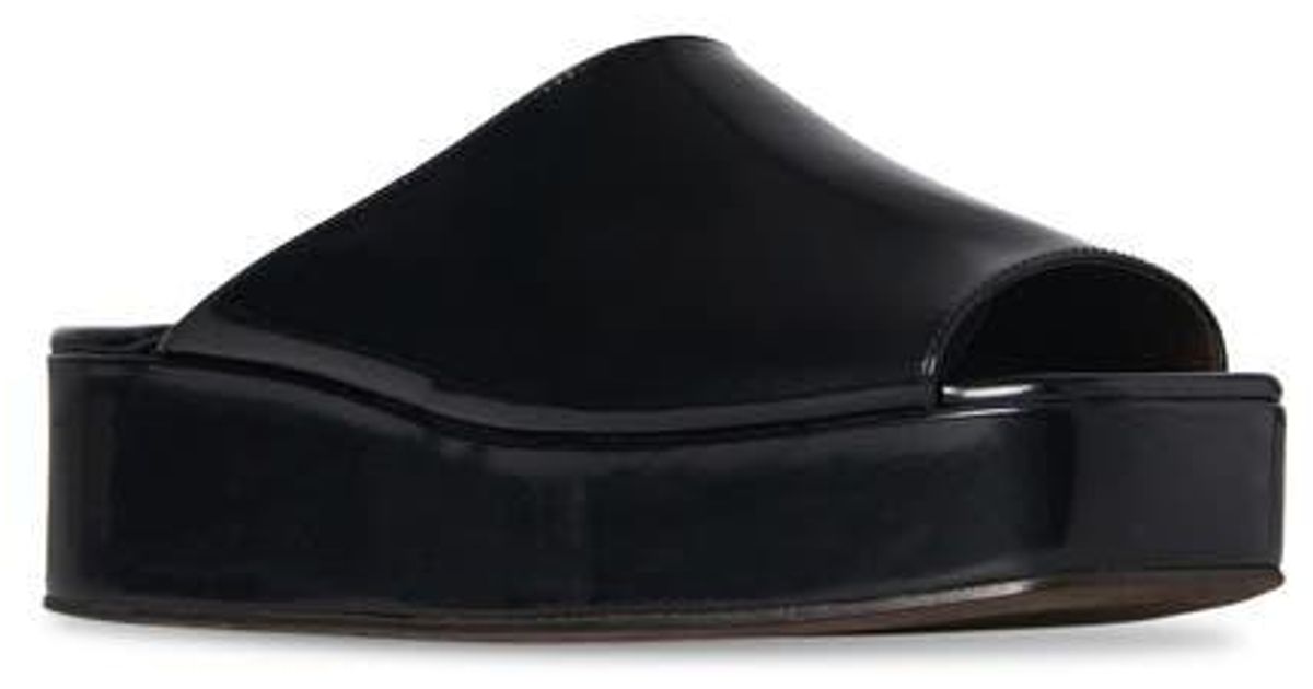 The Row Emi Flatform Slide Sandal in Black | Lyst