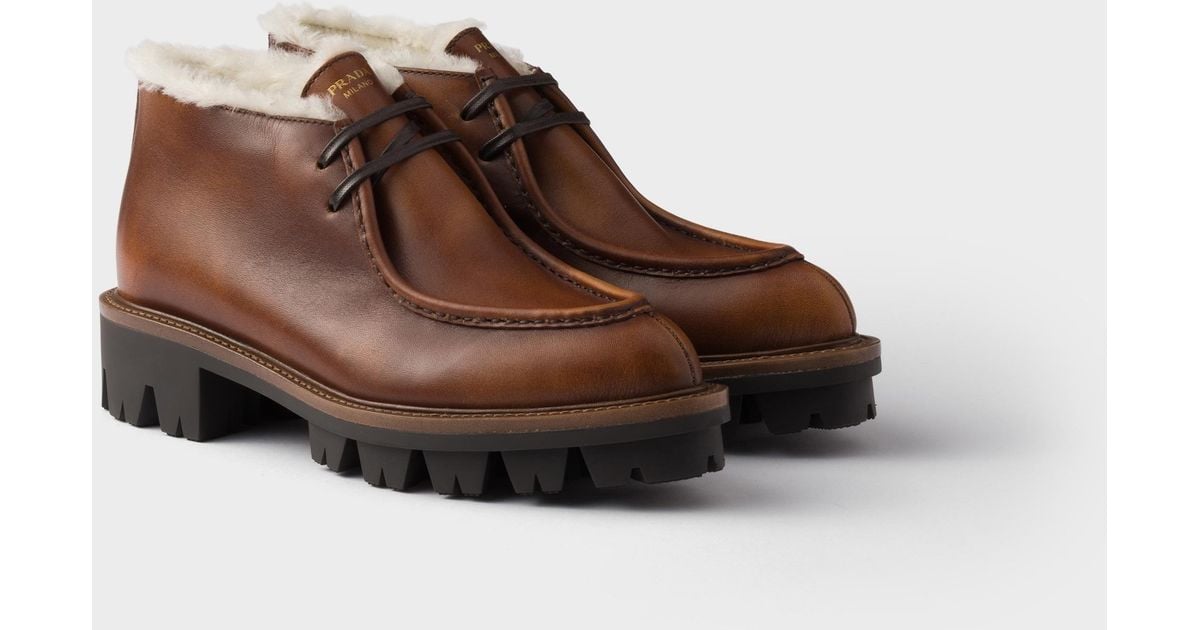 Prada Leather And Shearling Booties in Brown | Lyst