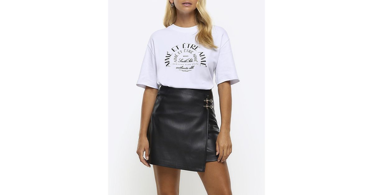 River Island Black Faux Leather Buckle Wrap Mini Skirt In White Lyst