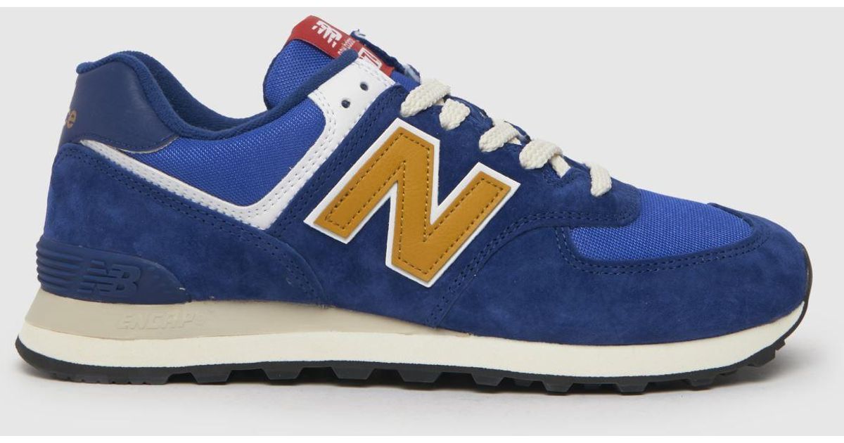 New Balance 574 Trainers In Navy & Gold in Blue for Men | Lyst UK