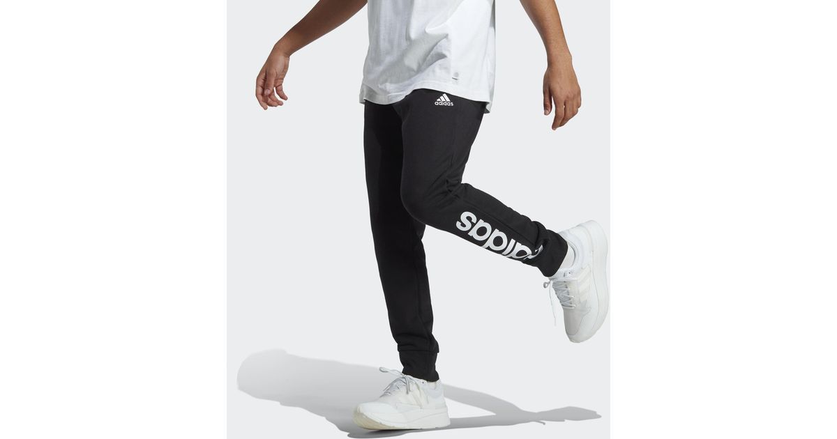 adidas Essentials French Terry Tapered Cuff Logo Pants in Black for Men ...