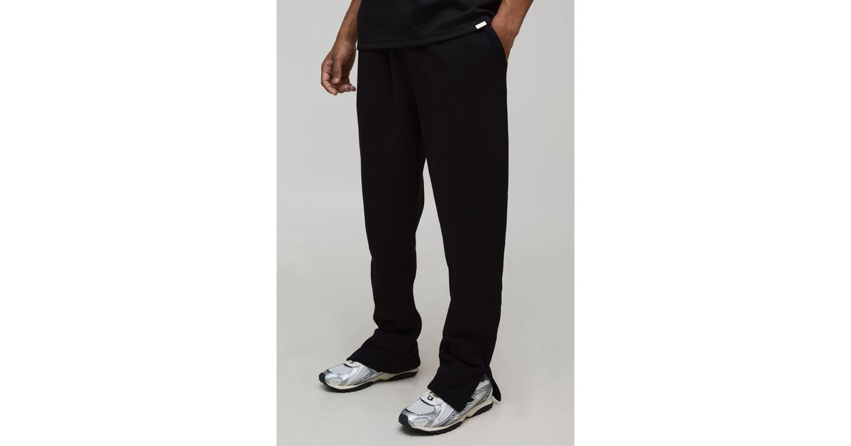 BoohooMAN Basic Regular Fit Split Hem Jogger in Black | Lyst UK