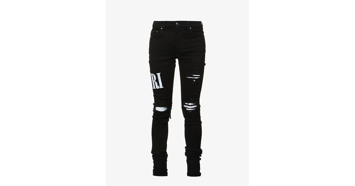 Amiri Tie-dye Underlay Distressed Skinny Stretch-denim Jeans in Black ...