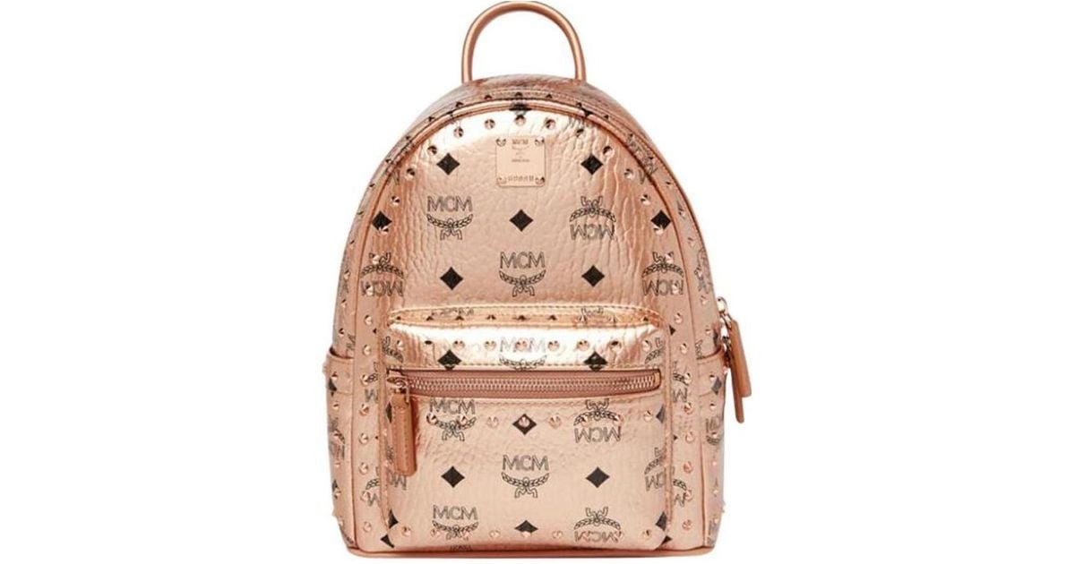 MCM Logo Printed Rivet Backpack in Pink | Lyst