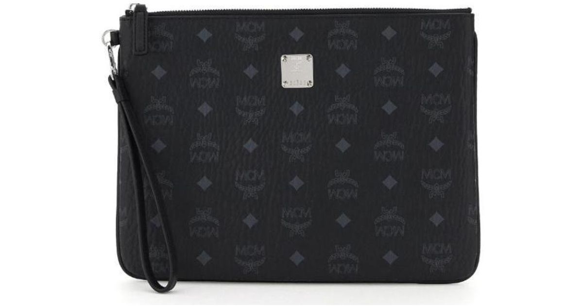 MCM Visetos Clutch in Black | Lyst