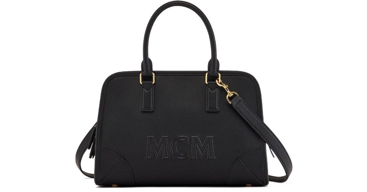 MCM Medium Logo Embossed Aren Boston Bag in Black | Lyst