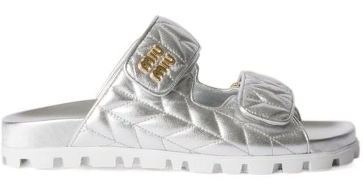 Miu Miu Metallic Matelassé Nappa Leather Slides in White | Lyst