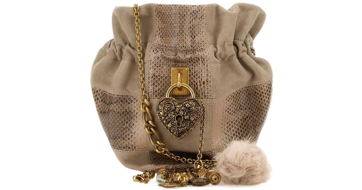 Chloé Chloé Lock Detailed Chained Drawstring Bag in Natural | Lyst