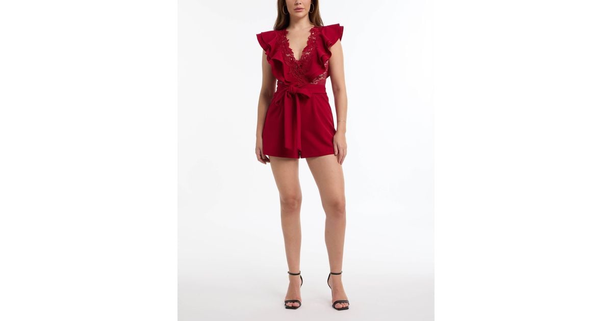 Bebe Flowy Cascade Lace Romper in Red | Lyst