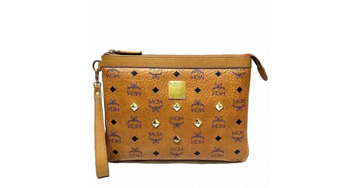 MCM Visetos Studded Clutch Bag in Metallic | Lyst