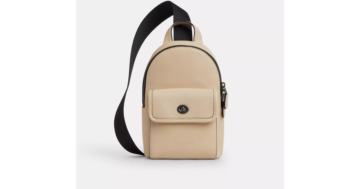 COACH Small Turnlock Sling Pack in Natural | Lyst