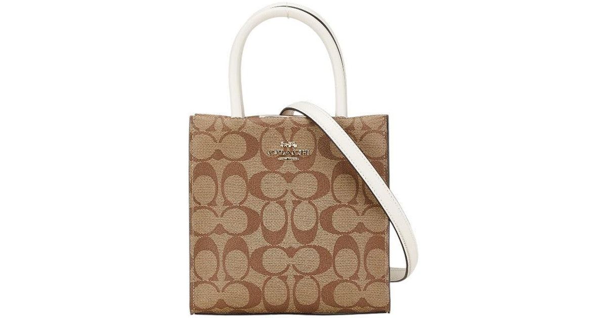 COACH Mini Carry Crossbody Signature Handbag in Brown | Lyst