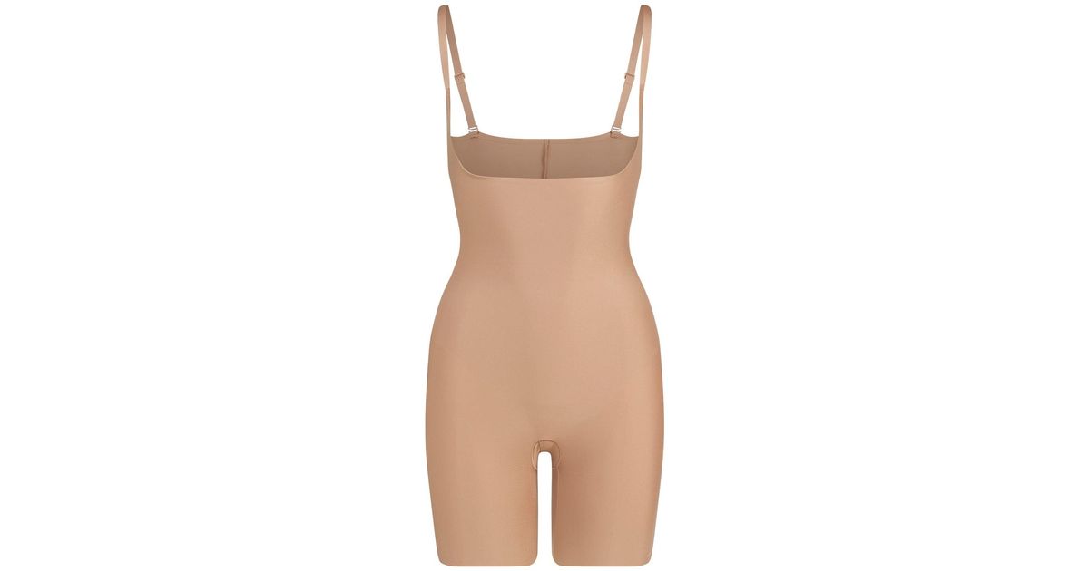 Skims Core Sculpt Open Bust Mid Thigh Bodysuit in White | Lyst