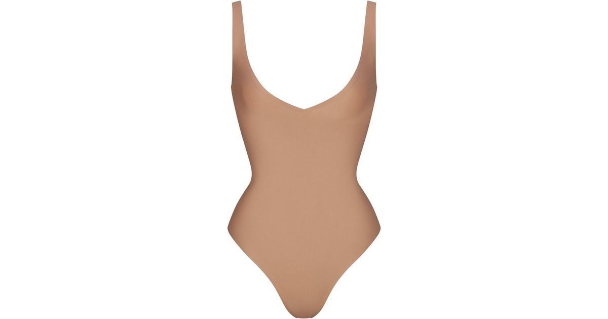 Skims Unlined Plunge Thong Bodysuit in Brown | Lyst