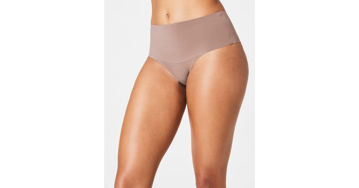 Spanx Supersmoothtm Undie-tectable® Modal Tanga in Natural | Lyst