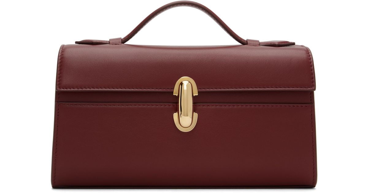 SAVETTE Burgundy Symmetry Pochette Bag in Red | Lyst