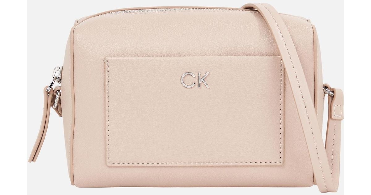 Calvin Klein Ck Daily Pebble-grain Faux Leather Camera Bag in Natural ...