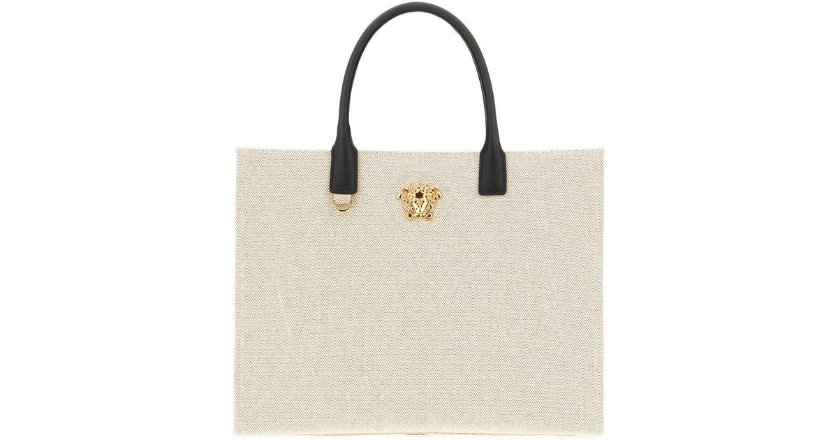Versace Handbags in Natural | Lyst