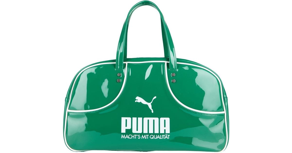 PUMA Duffel Bags in Green | Lyst UK