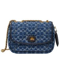 COACH Washed Denim Signature Swinger Bag in Blue | Lyst