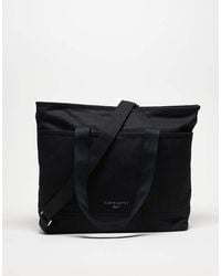 Carhartt Olney Faux Fur Side Bag in Black | Lyst UK