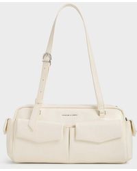 Charles & Keith Rachel Elongated Multi-Pocket Shoulder Bag in Red | Lyst