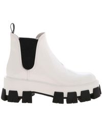 Prada Flat boots for Women - Up to 40% off at Lyst.com