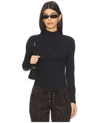 Oh Carla Turtle-Neck Bodysuit in White | Lyst UK