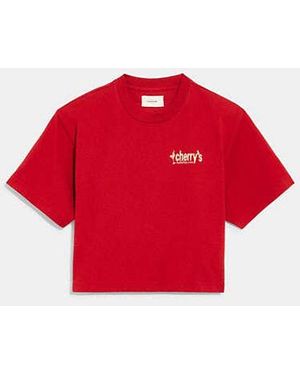 COACH Graphic Tops for Women | Lyst